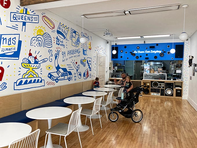 Whimsical wall art transforms this ice cream shop into an Instagram-worthy destination. The bright, playful interior makes enjoying a scoop feel like stepping into a modern art installation.