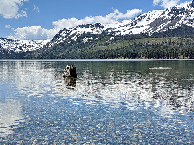 Mirror-like waters reflecting snow-capped mountains. Nature showing off its Photoshop skills without a subscription fee.