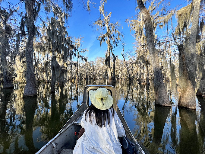 Drifting through cypress knees and Spanish moss with a wide-brimmed hat&mdash;the bayou's natural air conditioning system working overtime on this picture-perfect day.