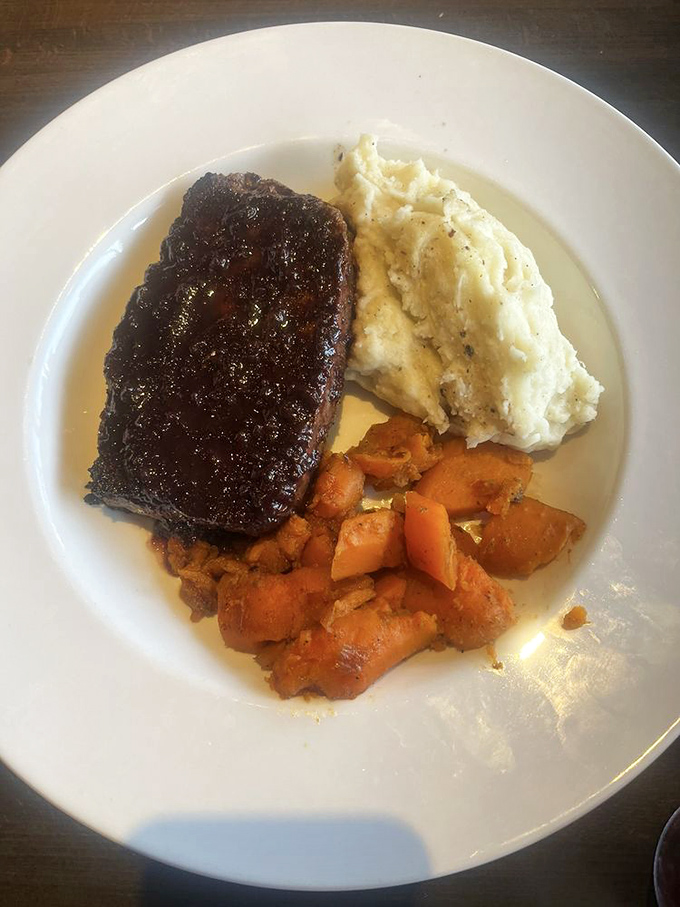 Not just breakfast! Their meatloaf arrives like a glistening mahogany masterpiece alongside cloud-like mashed potatoes and sweet roasted carrots.