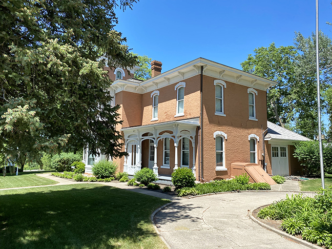 The stately Mellette House stands as a Victorian time capsule, its brick facade and white trim whispering tales of South Dakota's territorial days.