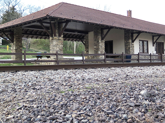 The historic train depot maintains the town's architectural theme, its stone pillars and sheltered platform a reminder of Hollister's railroad heritage.