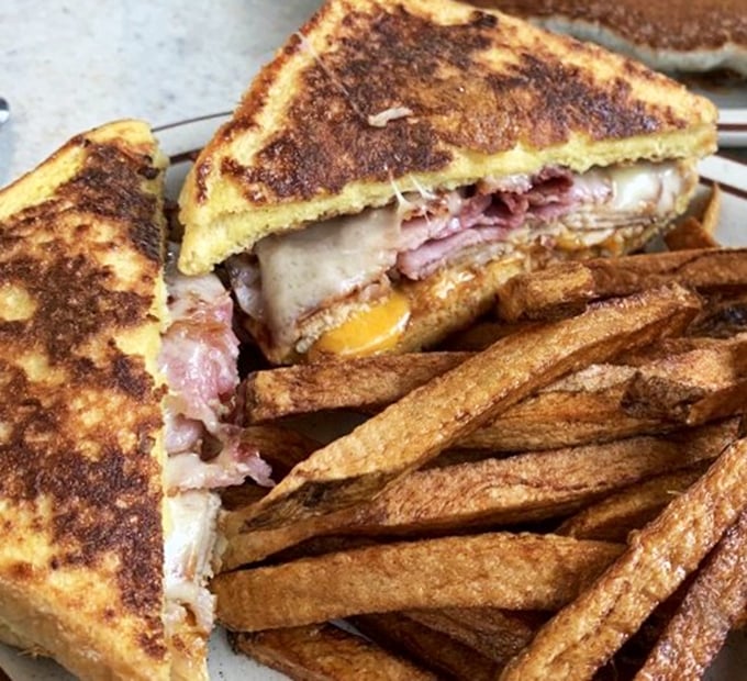 The Monte Cristo &ndash; where breakfast and lunch have a delicious identity crisis. Paired with those hand-cut fries, it's worth every napkin you'll need.