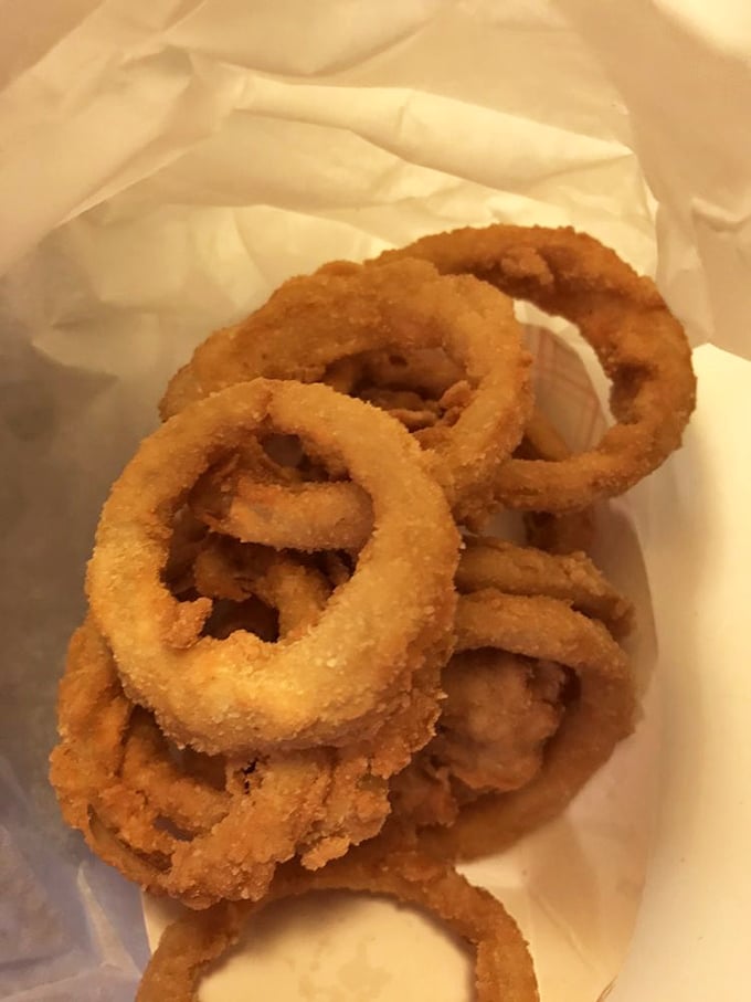 A bag full of golden-fried perfection! Crispy, savory rings are a must-have side dish from this great drive-in.
