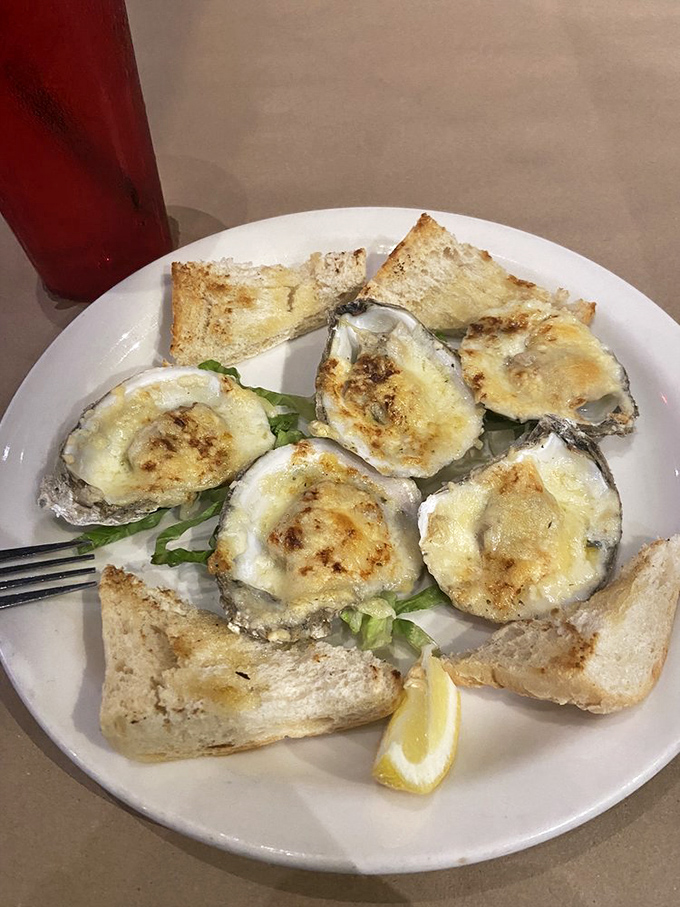 Oysters Rockefeller: where briny shellfish meets creamy, cheesy decadence. The toast points aren't just garnish &ndash; they're sauce delivery vehicles.