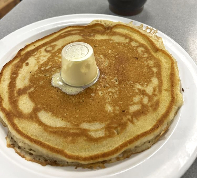 The pancake that launched a thousand food comas. Golden, fluffy, and topped with a perfect pat of butter&mdash;breakfast nirvana on a plate.
