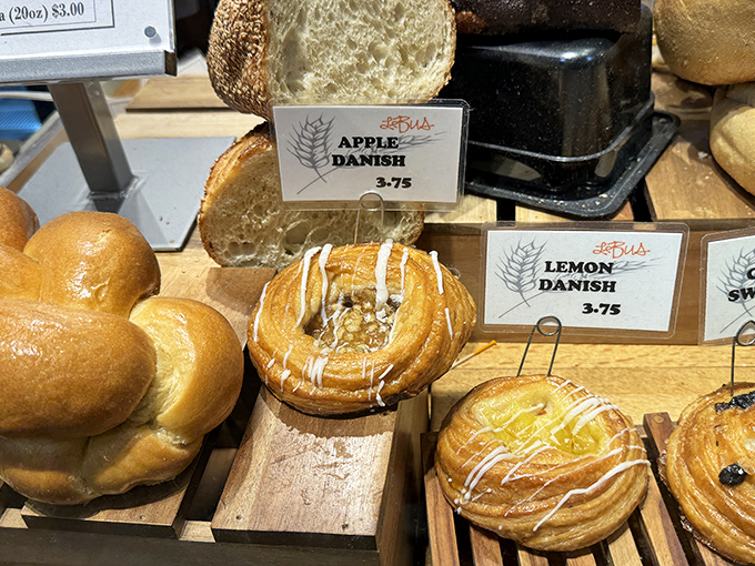 Danish pastries sharing space with the pretzels because apparently one carb temptation just wasn't enough torture.