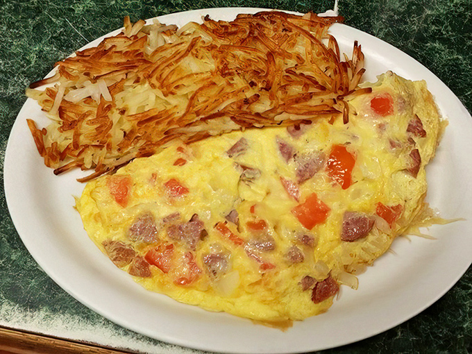 This omelet doesn't just contain reindeer sausage—it practically tells an Alaskan story. Paired with those perfectly crisped hash browns, it's the breakfast of northern champions.