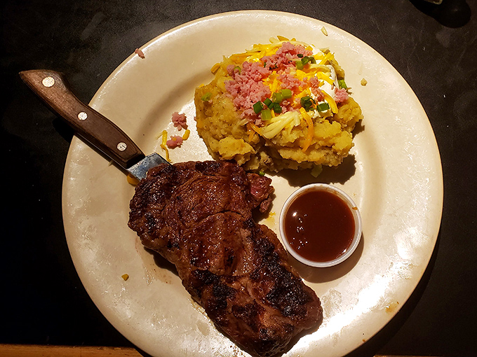 Behold the ribeye in its natural habitat – perfectly seared, seasoned with expertise, and accompanied by grilled asparagus that actually deserves to share the plate.