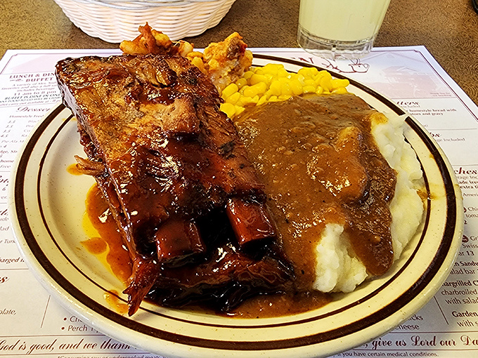 Those ribs have been thinking deep thoughts in the smoker, emerging fall-off-the-bone tender and gloriously sticky.