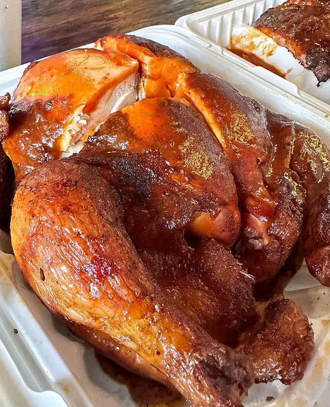 This chicken has clearly been introduced to smoke and spice in the most intimate way possible. The color alone tells you everything.