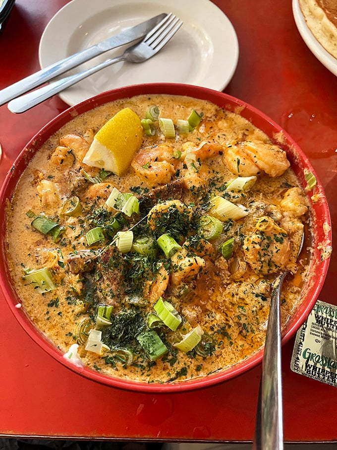 Shrimp and grits, Southern-style soul in a bowl. Those green onions aren't just garnish&mdash;they're the exclamation points on a delicious statement.