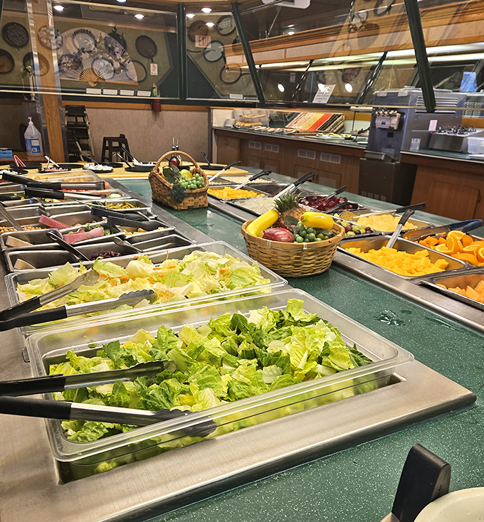 The salad bar stretches into the distance like a green oasis, offering virtuous options before the inevitable return to the hot food stations.