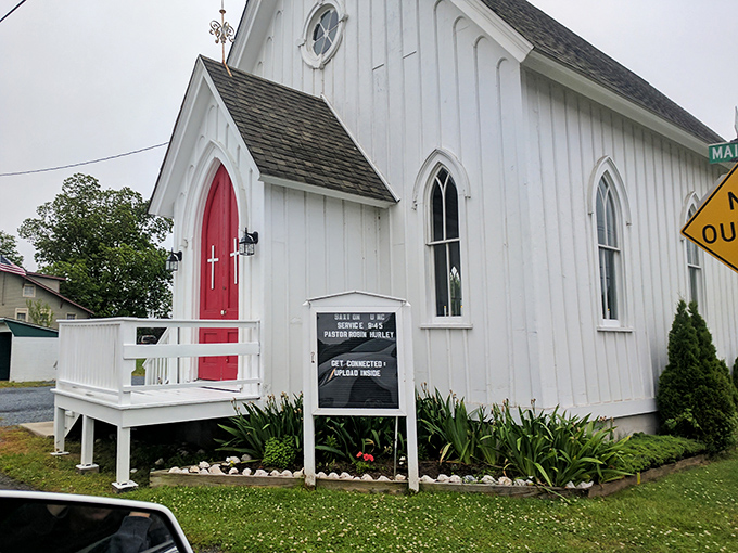 Saxton United Methodist Church's striking white exterior and bold red door stand as a spiritual lighthouse in this seafaring community. Faith meets nautical tradition.