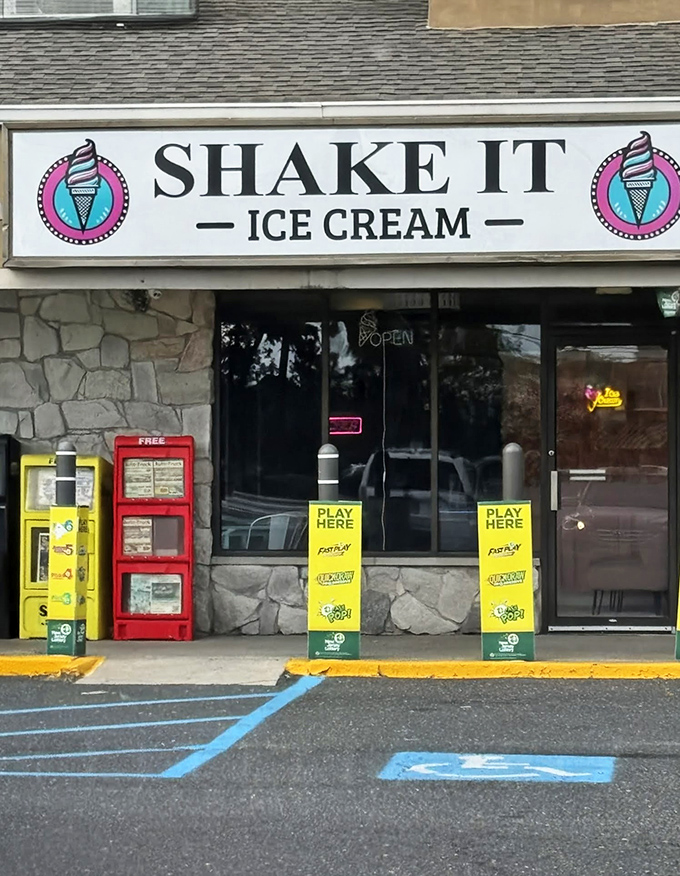 Shake It Ice Cream promises sweet relief from summer heat, with vintage gumball machines standing guard like colorful sentinels of childhood nostalgia.