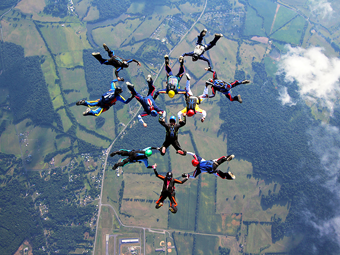 Skydivers form a perfect circle above Orange's patchwork countryside &ndash; proving some of the best views require jumping out of a perfectly good airplane.