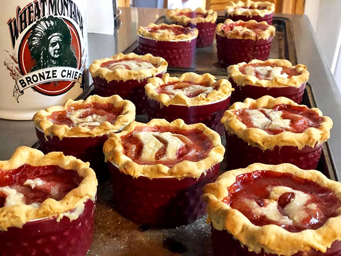 Strawberry rhubarb pies in their crimson glory, waiting to fulfill their destiny. Wheat Montana flour ensures these aren't your average roadside desserts.