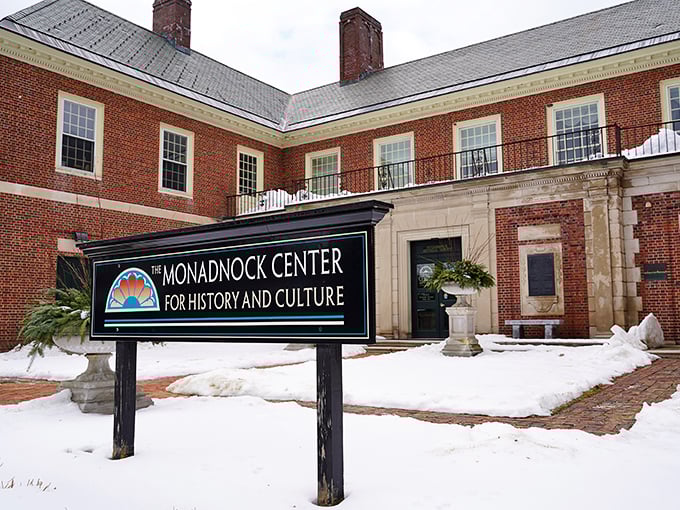The Monadnock Center stands proudly in winter's embrace. Behind those brick walls, stories of Peterborough's past wait to be discovered.