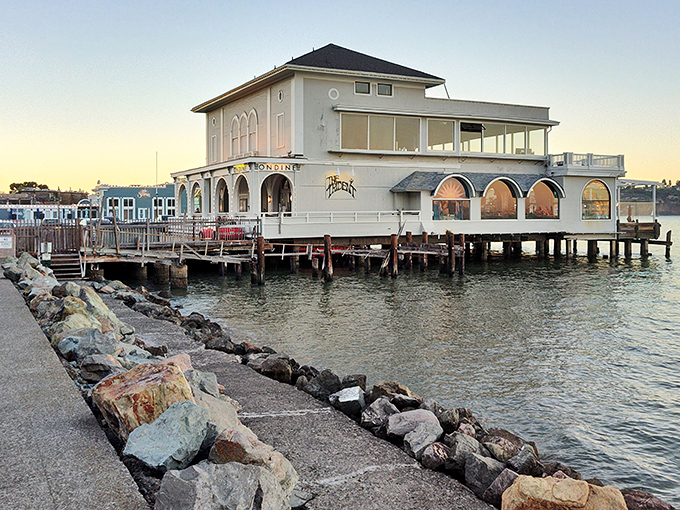 Trident Restaurant juts over the water like a ship that decided to drop anchor and serve seafood instead of sailing.