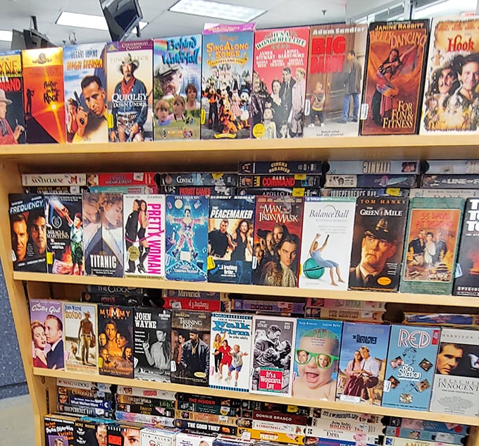 VHS tapes: the vinyl records of movie collecting. This nostalgic wall of cinematic history features everything from "Titanic" to "Pretty Woman"—rewinding optional.