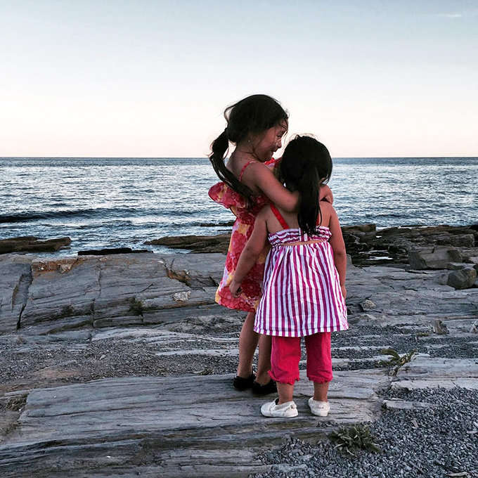 Childhood memories in the making. Two small explorers discover that some views are better when shared with someone who makes your heart full.