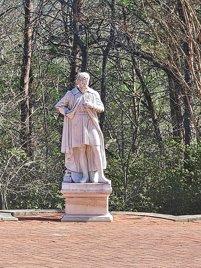 Classical statuary stands sentinel in the gardens, adding Old World elegance to this mountain retreat's outdoor spaces.