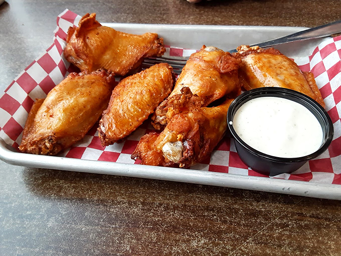 These wings aren't just crispy, they're having an out-of-body experience &ndash; transcending ordinary chicken parts into crispy, sauce-kissed flavor bombs.