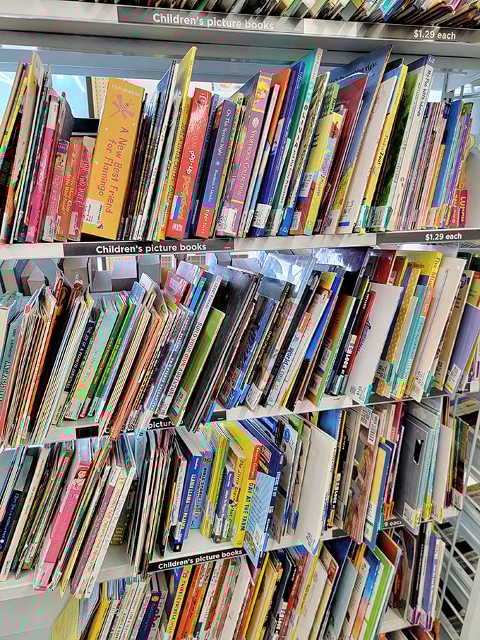 Children's books stacked like colorful promises &ndash; each spine holding adventures that cost less than the hot chocolate you'll drink while reading them.