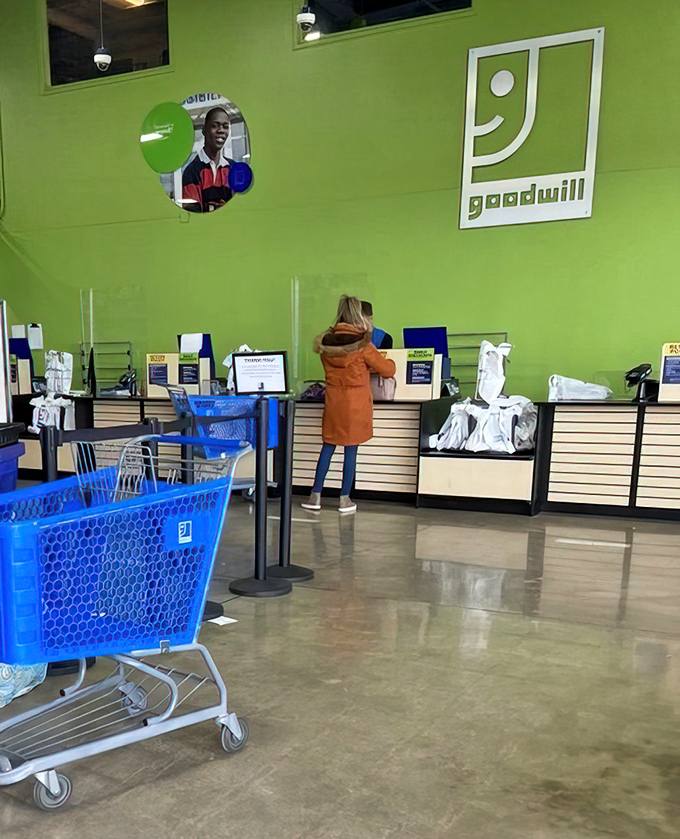 The final frontier: checkout counters where friendly staff ring up your treasures against a backdrop of Goodwill's signature green.