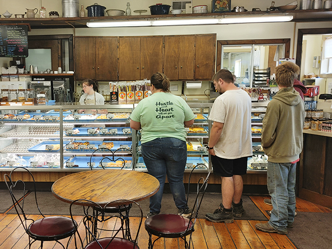 The universal language of anticipation&mdash;customers lining up at the counter, united in their quest for that perfect pastry fix.