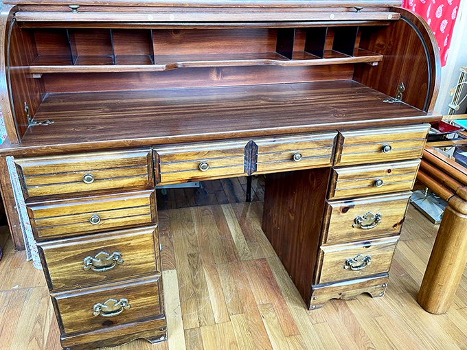 This roll-top desk isn't just furniture; it's a portal to a time when people wrote letters and kept secrets in tiny drawers.