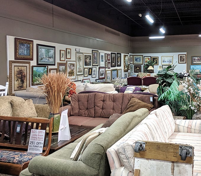 The wall of framed memories creates an impromptu gallery. Someone's discarded Thomas Kinkade is another's living room masterpiece waiting to happen.