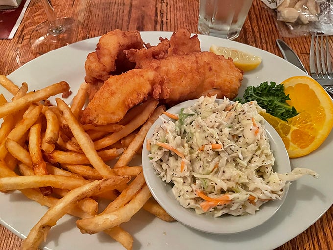 Golden-battered fish with a perfect crunch, accompanied by crispy fries and house-made coleslaw&mdash;proof that simplicity, when done right, is culinary poetry.
