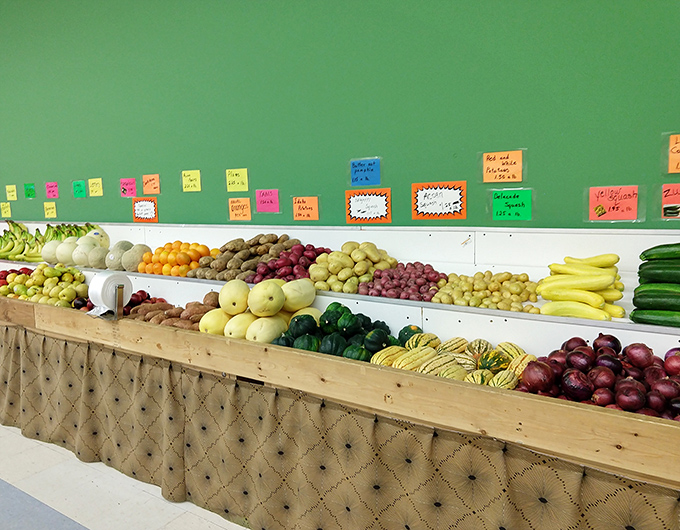 Nature's candy counter! This produce display transforms ordinary grocery shopping into a vibrant treasure hunt for the perfect peach or plumpest tomato.