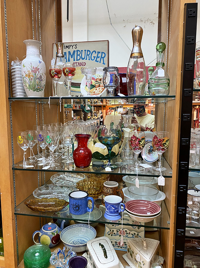 Wimpy's Hamburger Stand sign watches over glassware that's survived decades of dinner parties &ndash; these goblets have probably heard better toasts than yours.