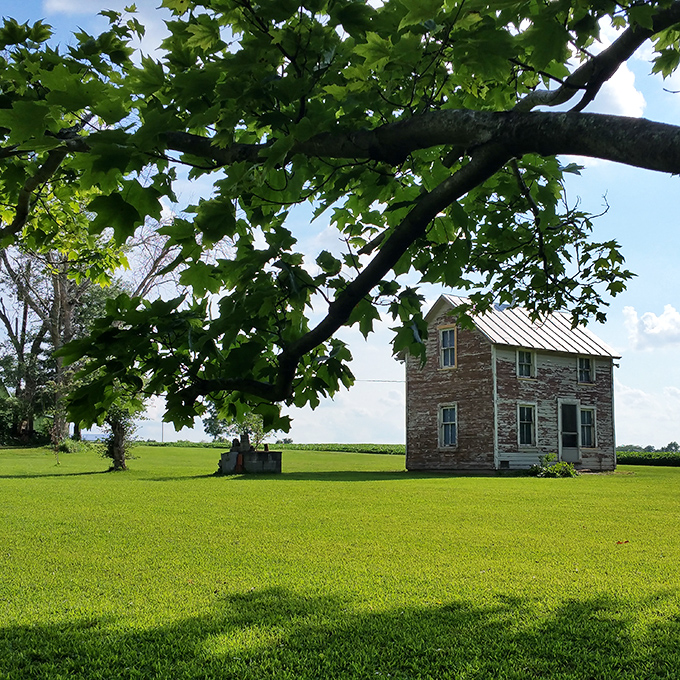 This historic stone house stands as a time capsule amid rolling green fields, whispering stories of Ohio's past to anyone who'll listen.