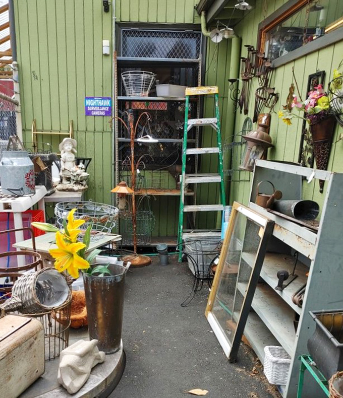 The outdoor overflow area: where garden treasures, vintage windows, and that perfect plant stand you didn't know you needed patiently wait.