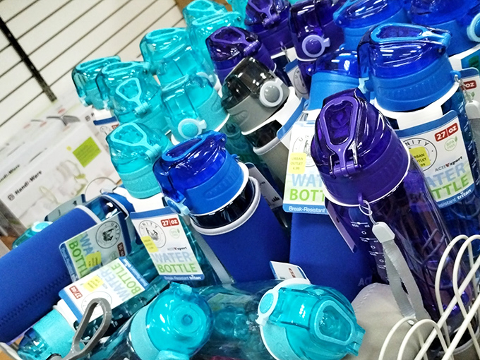 A rainbow of water bottles stands at attention, ready to hydrate bargain hunters through marathon shopping sessions without the marathon price tag.