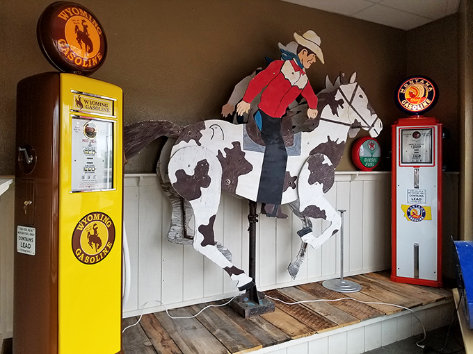 This isn't just a cowboy on a horse &ndash; it's Wyoming's transportation evolution story told through vintage gas pumps and western iconography.