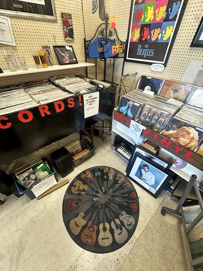 Vinyl heaven for music lovers. That circular display of miniature guitars is the perfect centerpiece for conversations about "real music."
