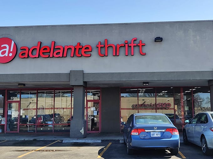 Adelante Thrift's bold red signage stands out against the gray building. Like finding a ruby in the rough!