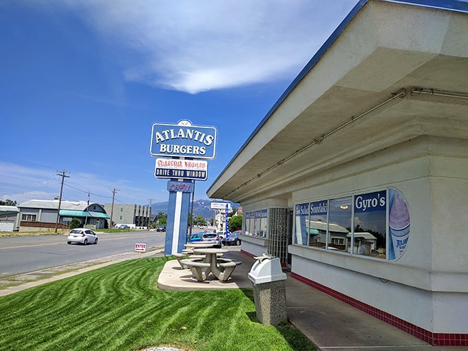 Atlantis Burgers' vintage sign and simple white building hide treasures that would make Poseidon himself surface for a bite.