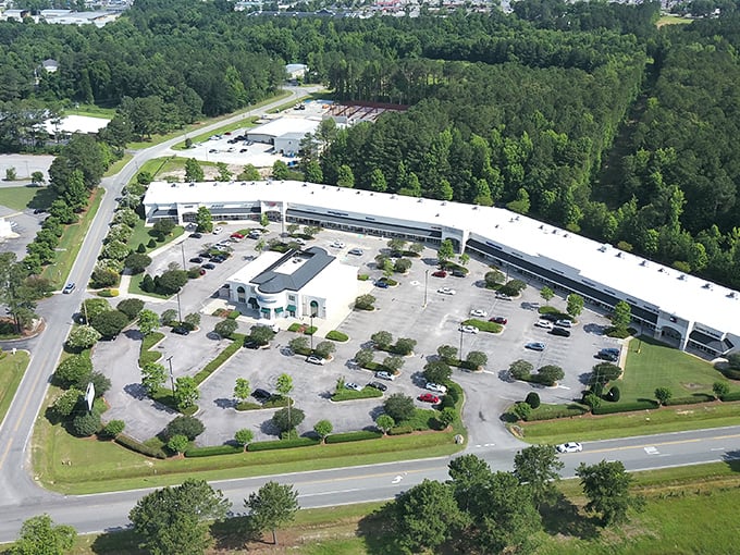 An aerial view reveals Carolina Premium Outlets' thoughtful layout and ample parking. No need for binoculars to spot your car after a successful shopping spree!