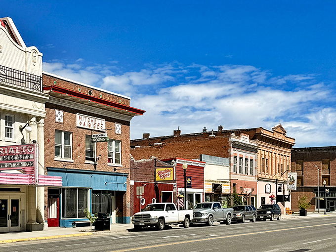 Deer Lodge's historic buildings stand proudly against Montana's blue sky, like sentinels guarding the town's rich western heritage.