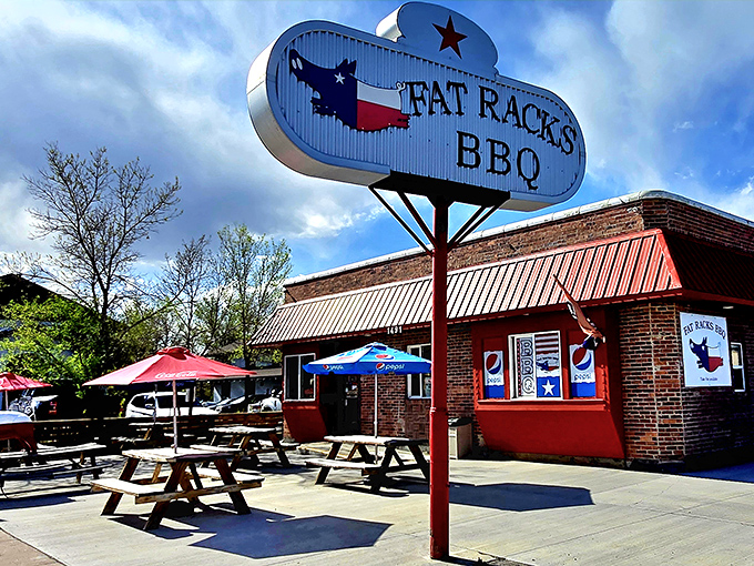 Fat Racks' Texas-sized sign and outdoor picnic tables promise a proper BBQ experience in the heart of Cody.
