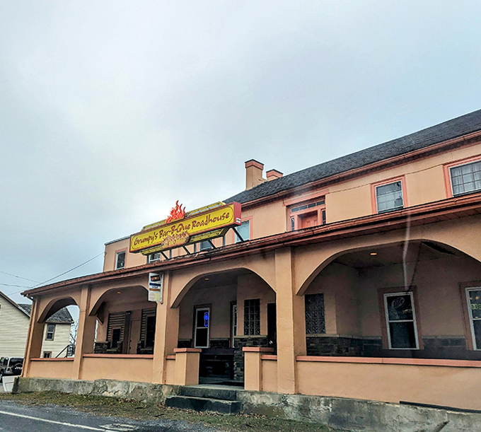 Grumpy's peachy facade and welcoming porch promise there's nothing grumpy about the BBQ experience waiting inside.