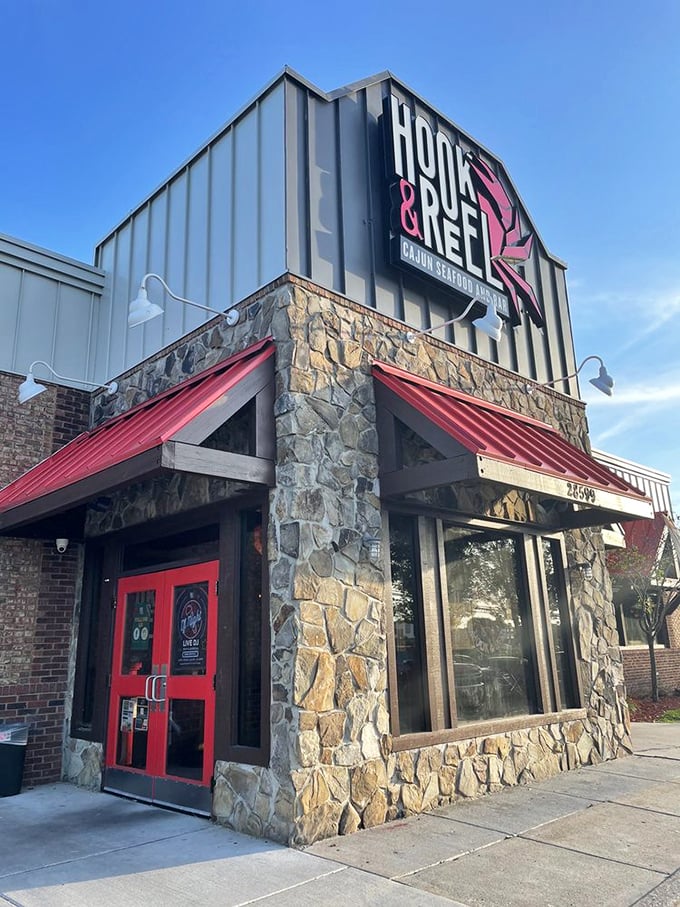 Hook & Reel's bold red doors are your gateway to Cajun seafood heaven. Stone and brick outside, spice and everything nice inside!