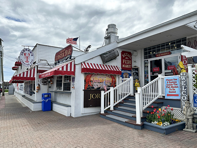 That festive red and white striped awning promises a carnival of fresh seafood delights waiting inside.