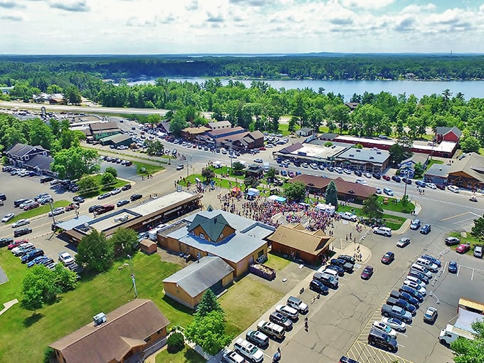 Aerial view of Nisswa shows a charming lakeside town where nature and commerce meet in perfect Minnesota harmony.