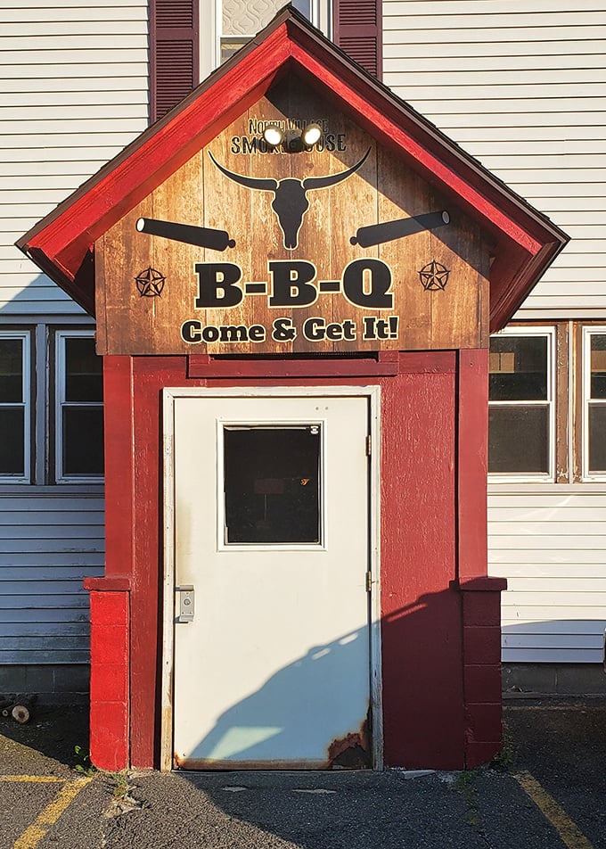 North Village Smokehouse entrance: This little red BBQ cabin with its wooden sign doesn't need fancy words - "Come & Get It!" says everything you need to know.